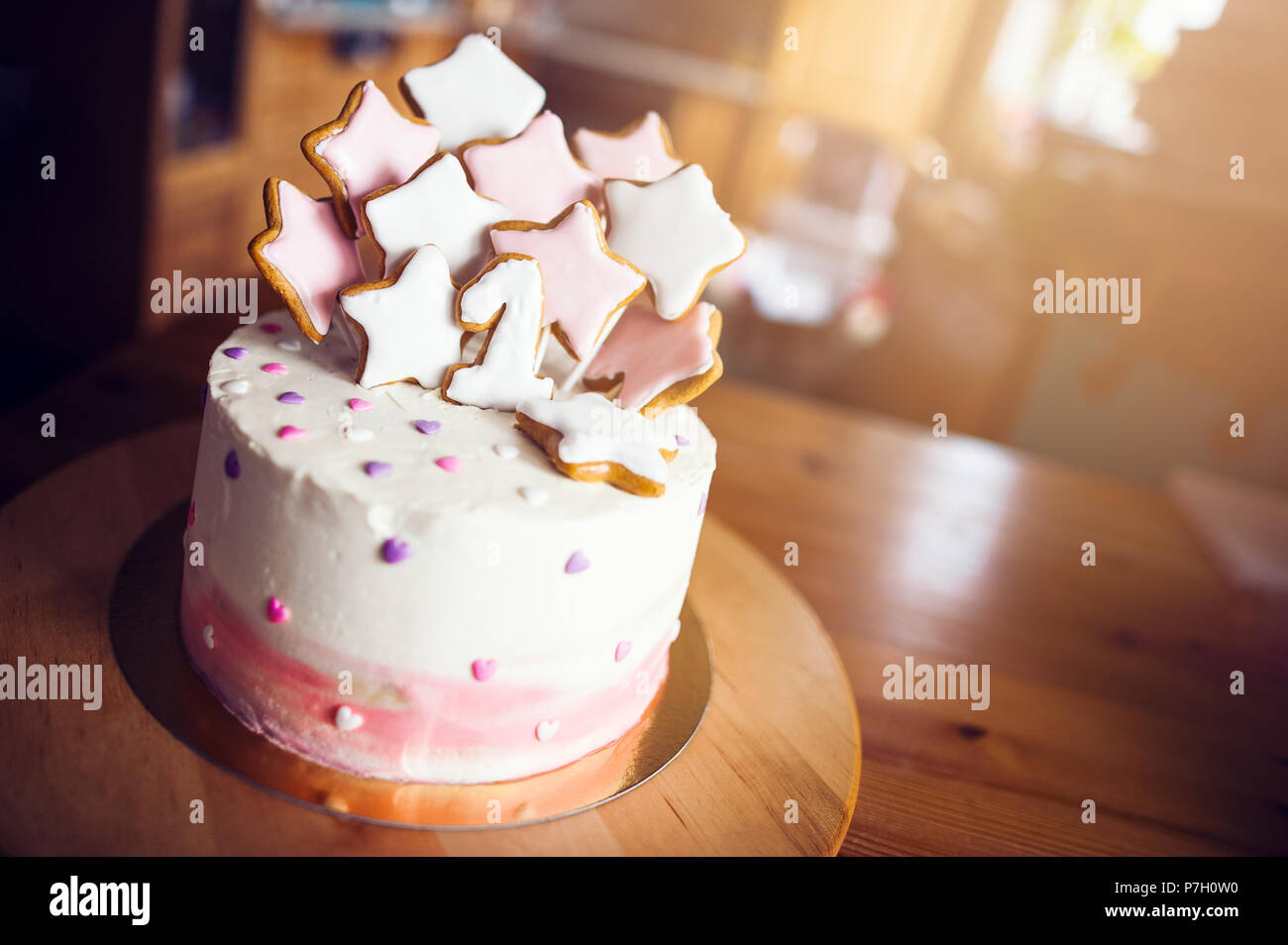 modern birthday cake with gingerbread stars and number one Stock Photo ...