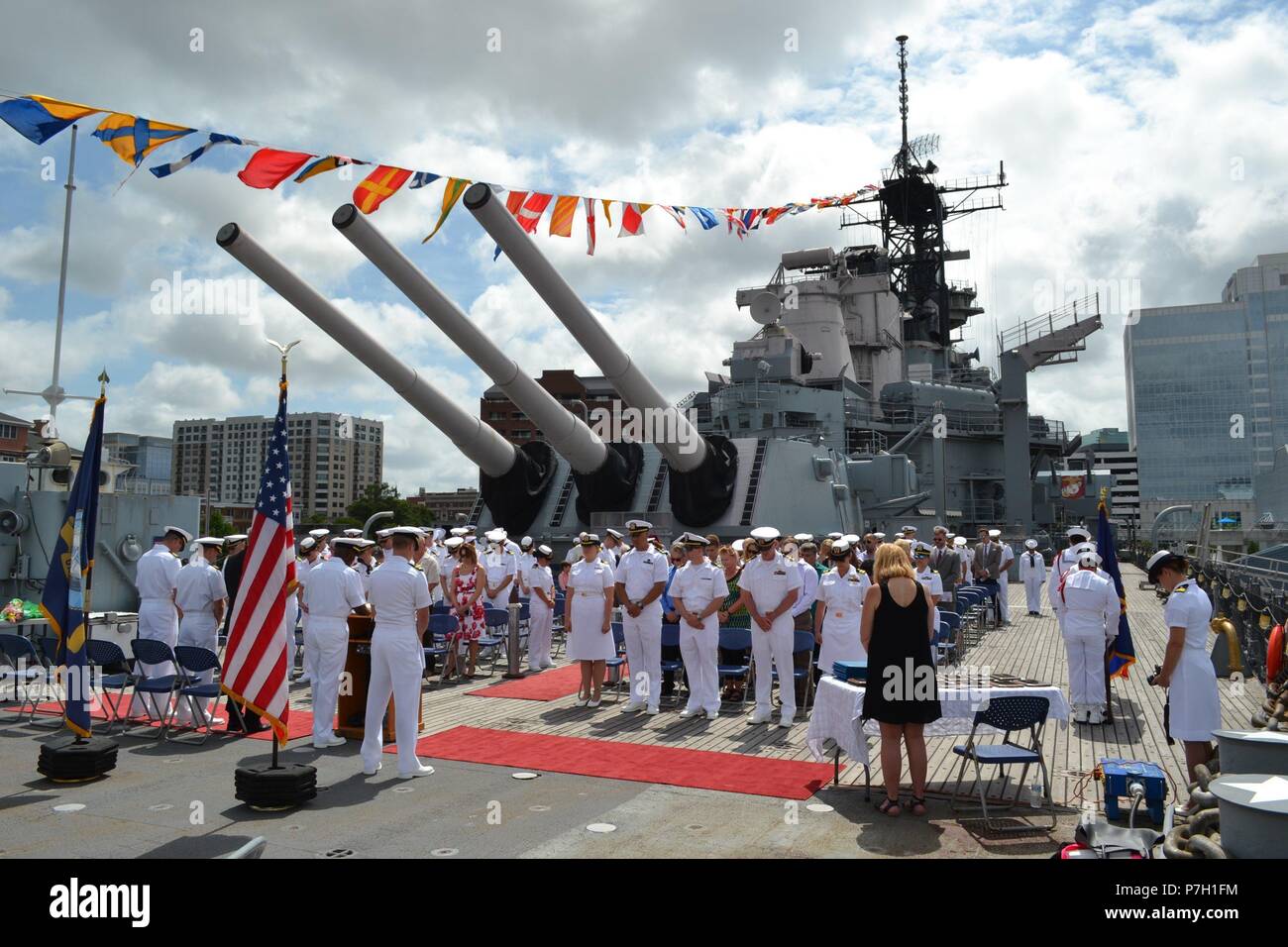 LCDR Devon Foster, CHC, USN, delivers the invocation during a ...