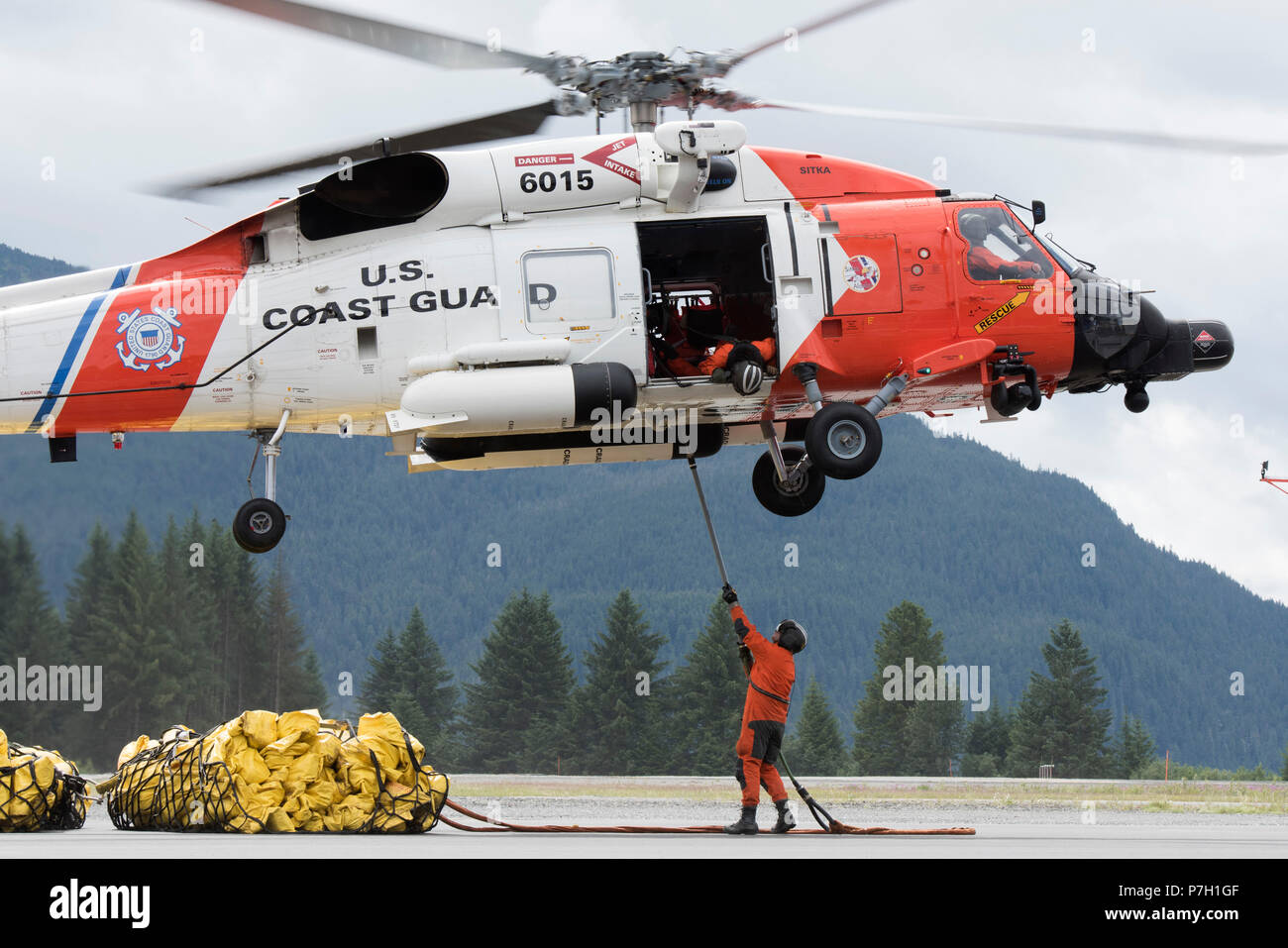 A Coast Guard Air Station Sitka MH-60 Jayhawk helicopter crew prepares ...