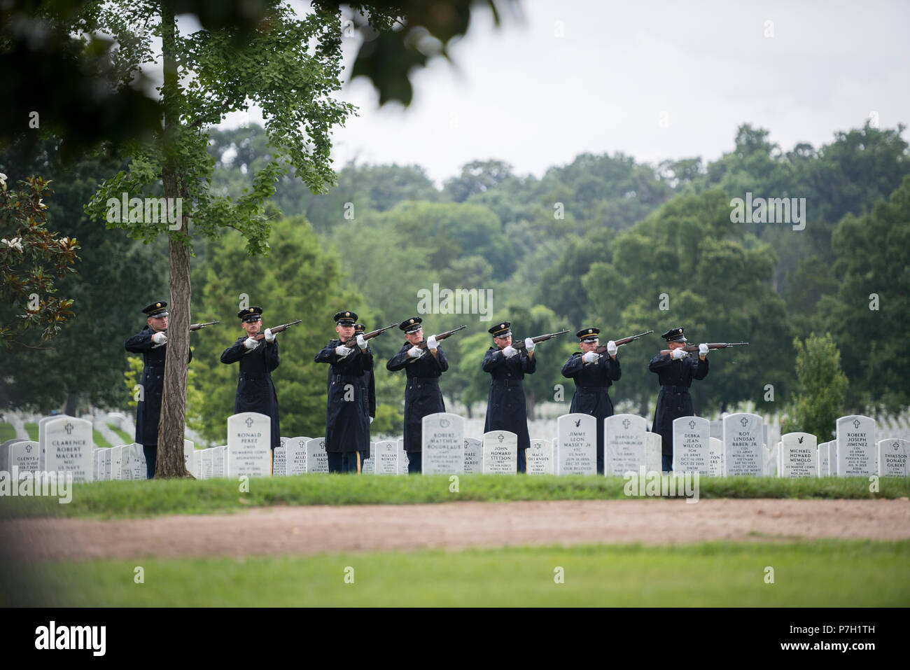 The U.S. Army Honor Guard Firing Party fires 3-rifle volleys during a ...