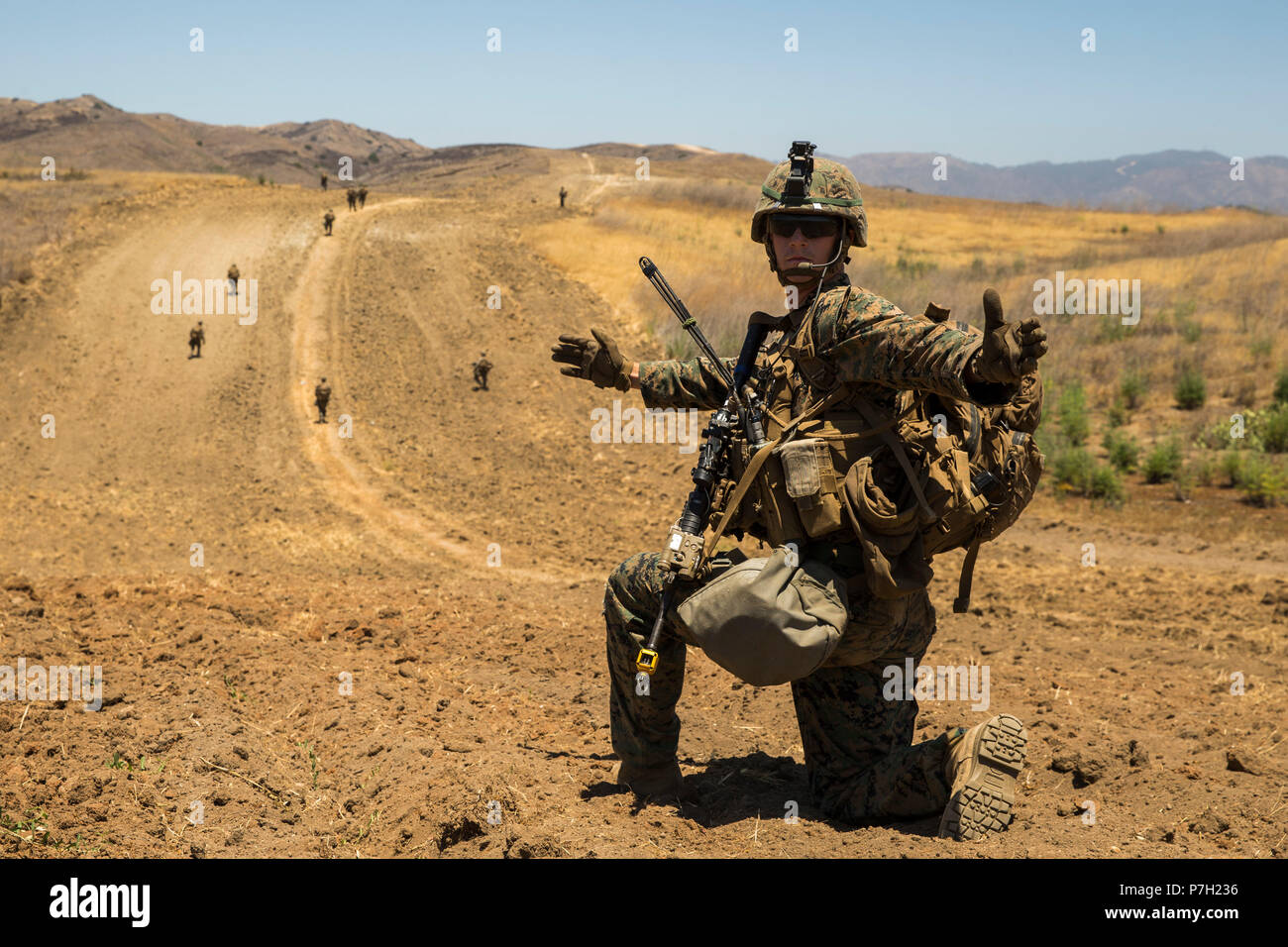 A U.S. Marine with 1st Light Armored Reconnaissance Battalion, 1st ...