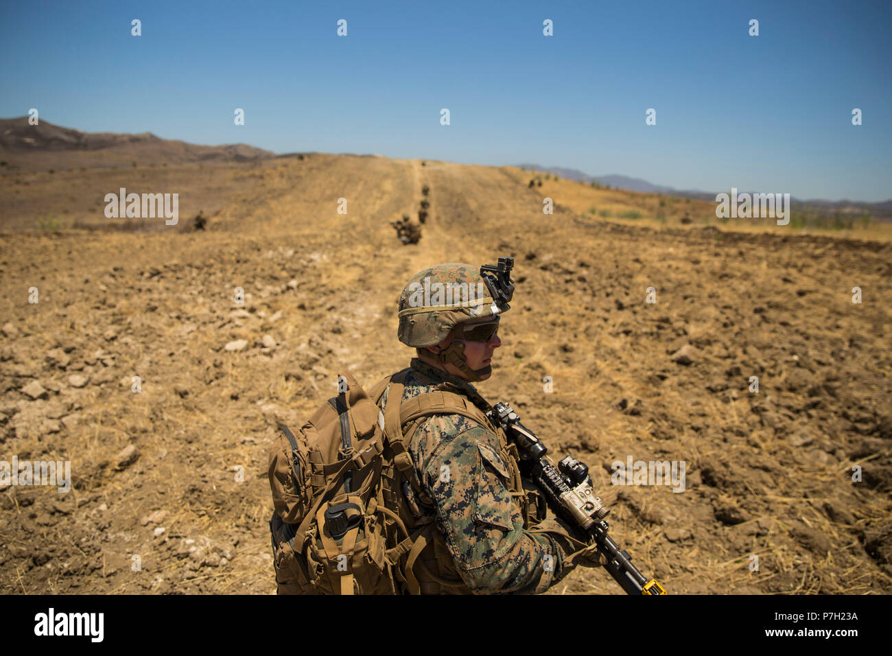 A U.S. Marine with 1st Light Armored Reconnaissance Battalion, 1st ...