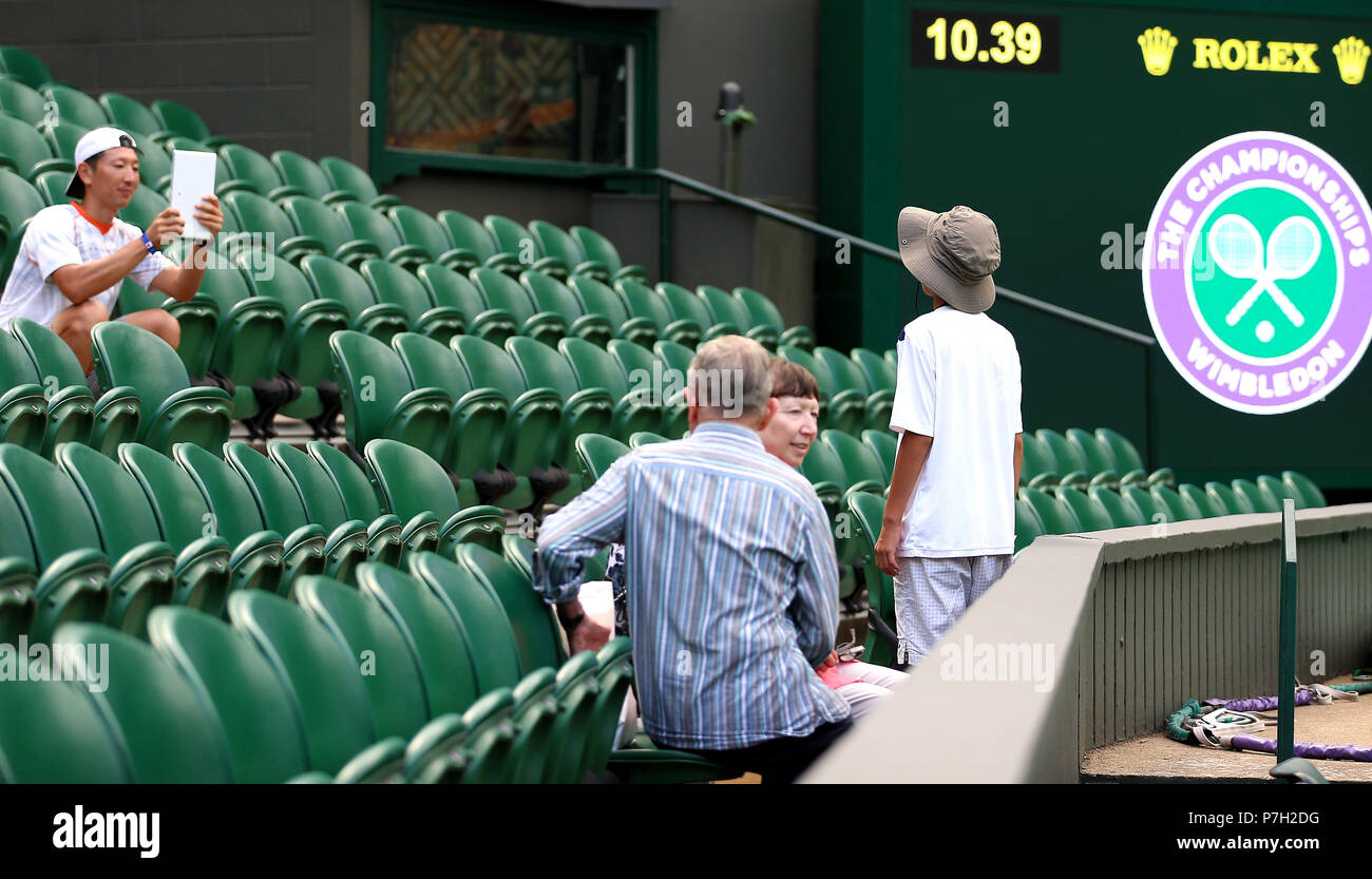 Spectators pose for a picture in the grounds at the start of day five ...