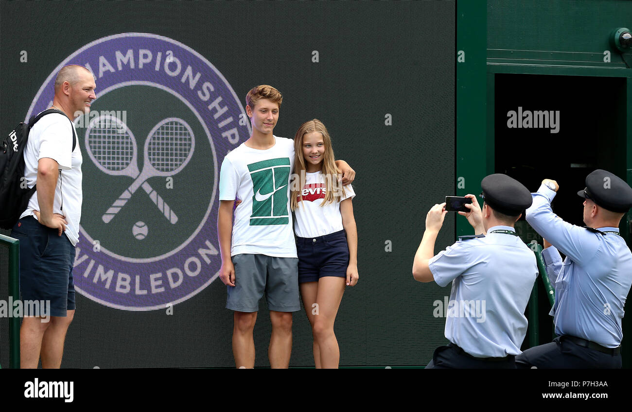 Members of the armed forces take photos for spectators at the start of ...