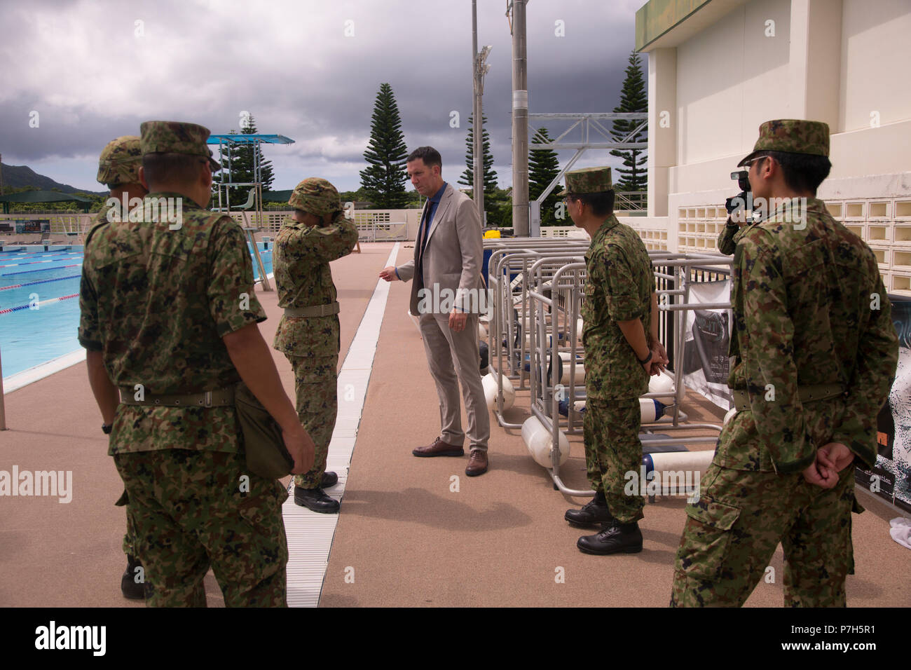 CAMP HANSEN, OKINAWA, Japan – Richard Ryan shows the visiting Japan ...