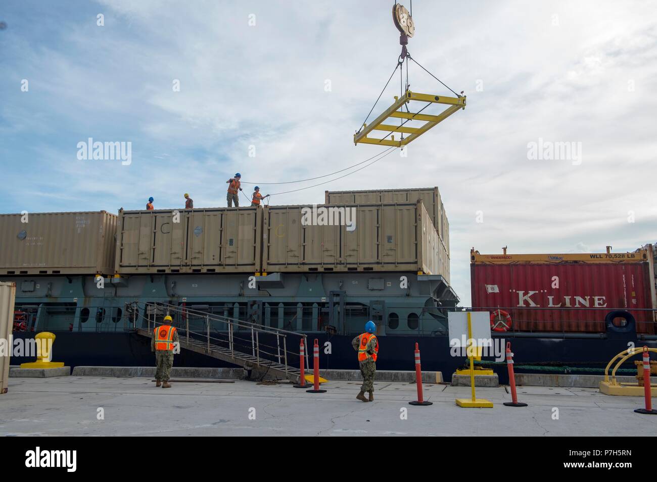 Sailors assigned to Navy Cargo Handling Battalion (NCHB) 1, Det. Guam ...