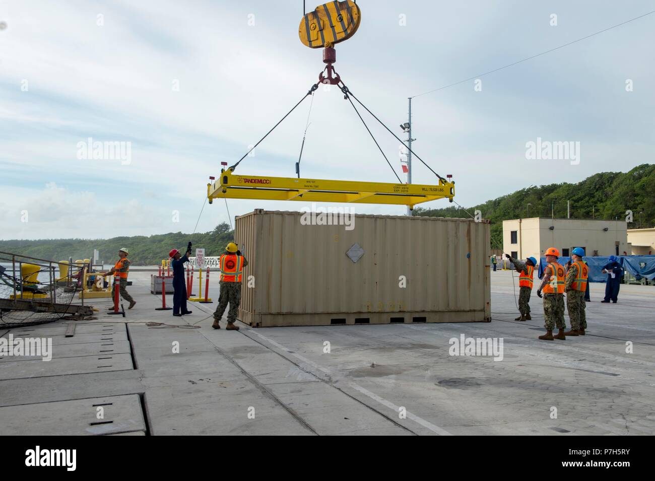 Sailors assigned to Navy Cargo Handling Battalion (NCHB) 1, Det. Guam ...