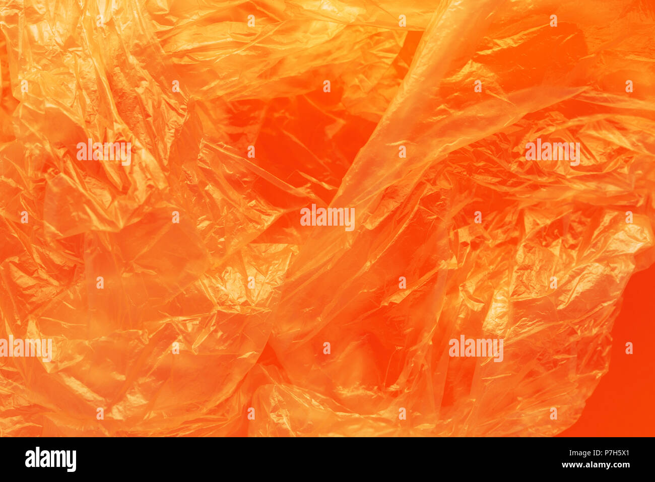 Orange plastic bag, environmental pollution conceptual background image ...
