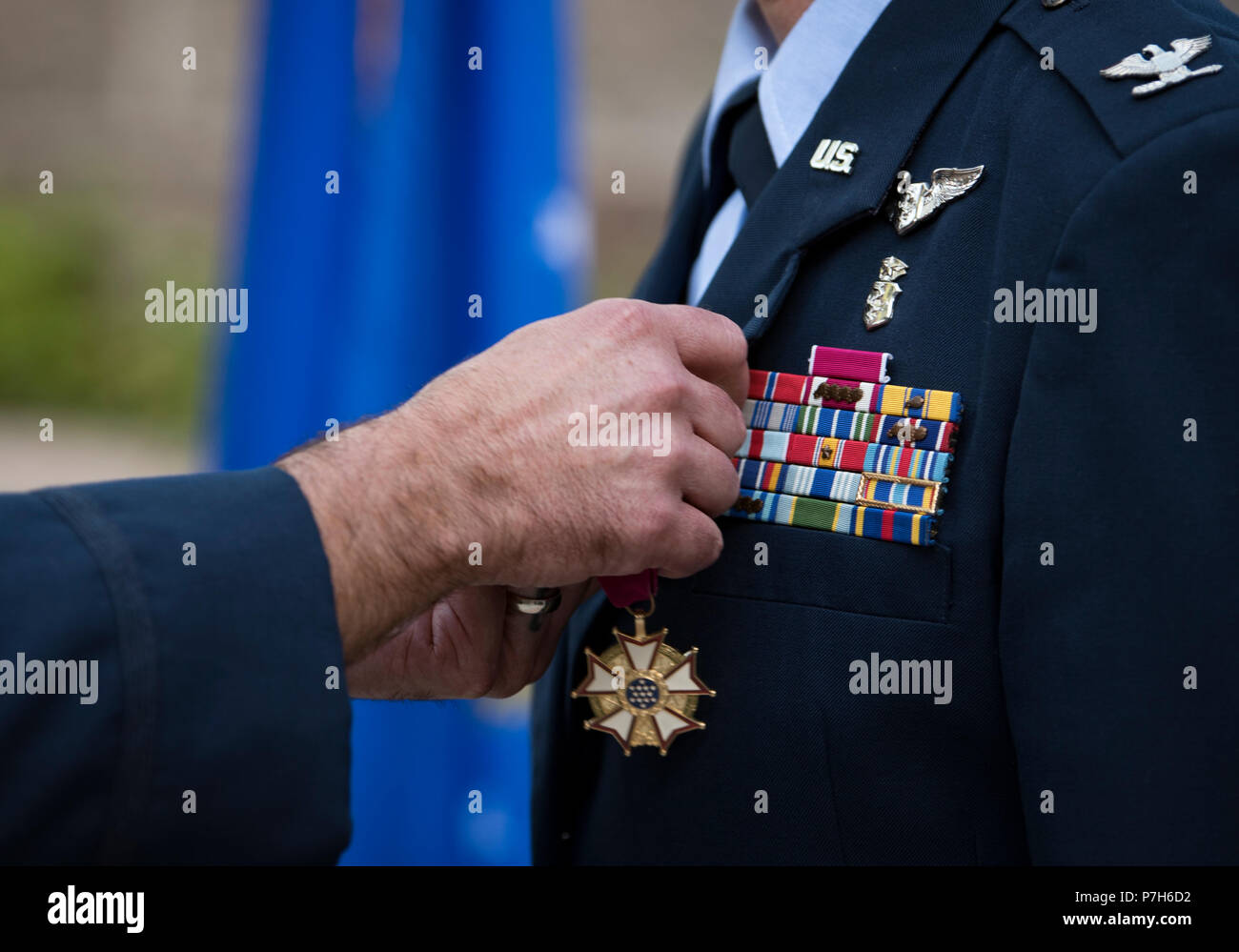 Col. Cavan Craddock, 99th Air Base Wing commander, awards a Legion of ...