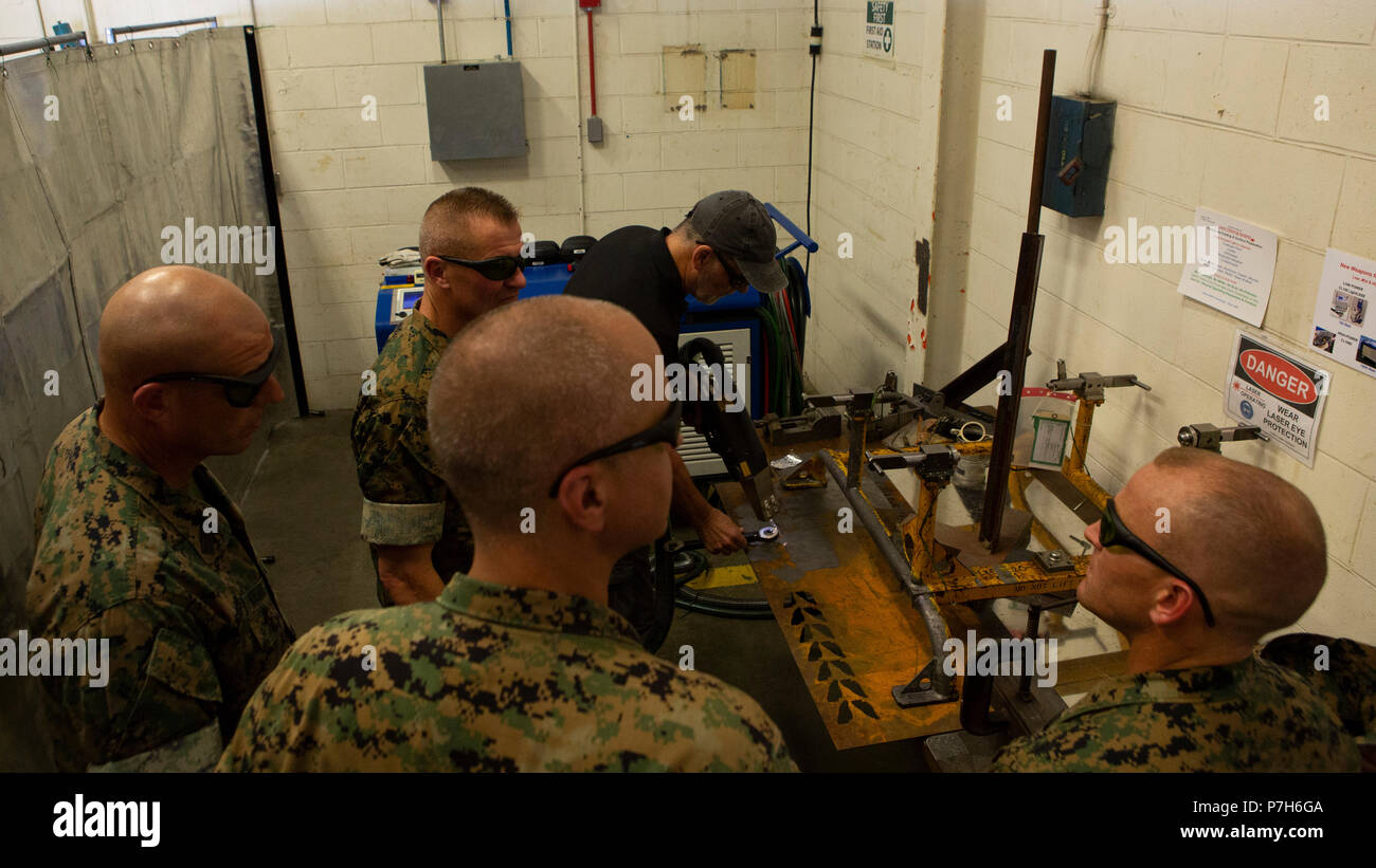 U.S. Marine Brig. Gen. Karsten S. Heckl watches a product demonstration ...
