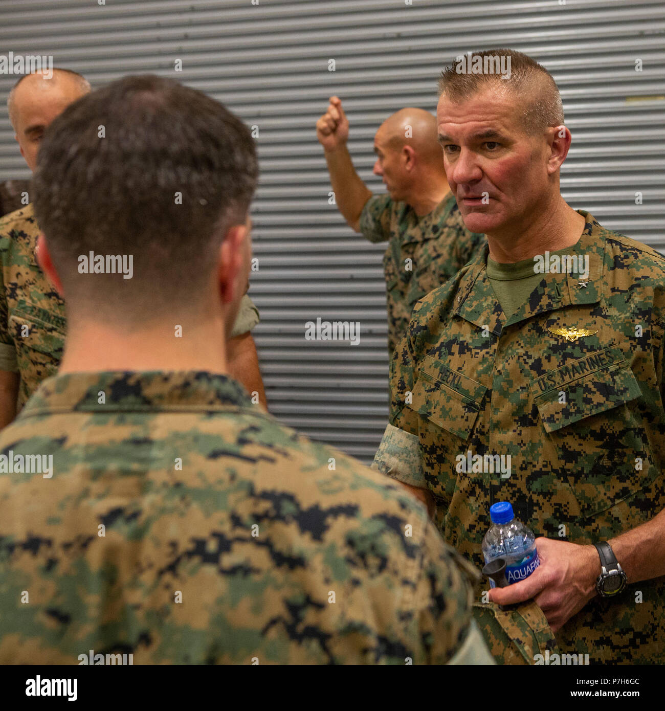 U.S. Marine Brig. Gen. Karsten S. Heckl watches a product demonstration ...