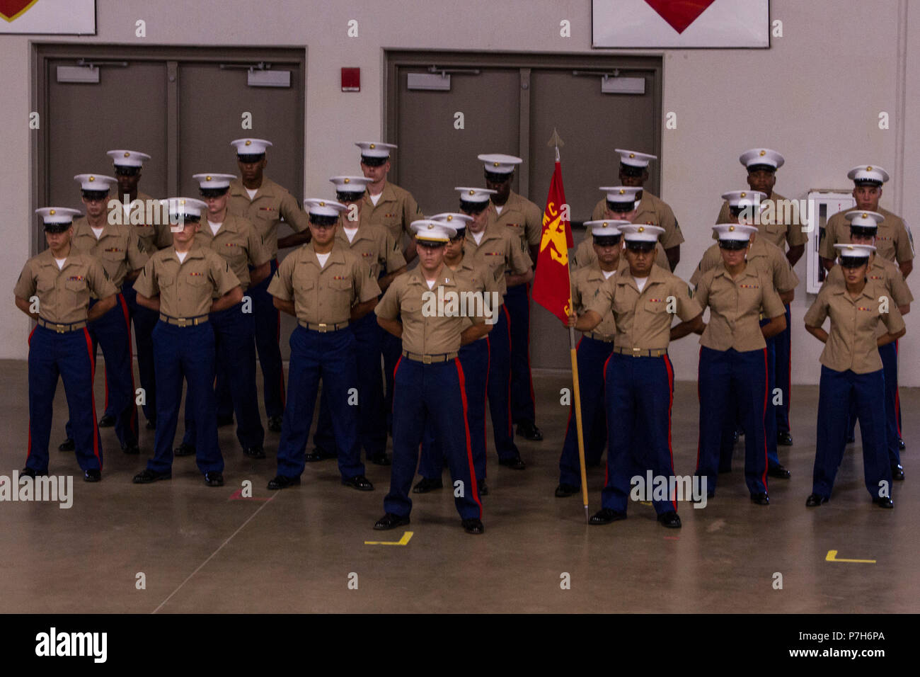 Marines with 6th Marine Corps District (MCD) stand at parade rest ...