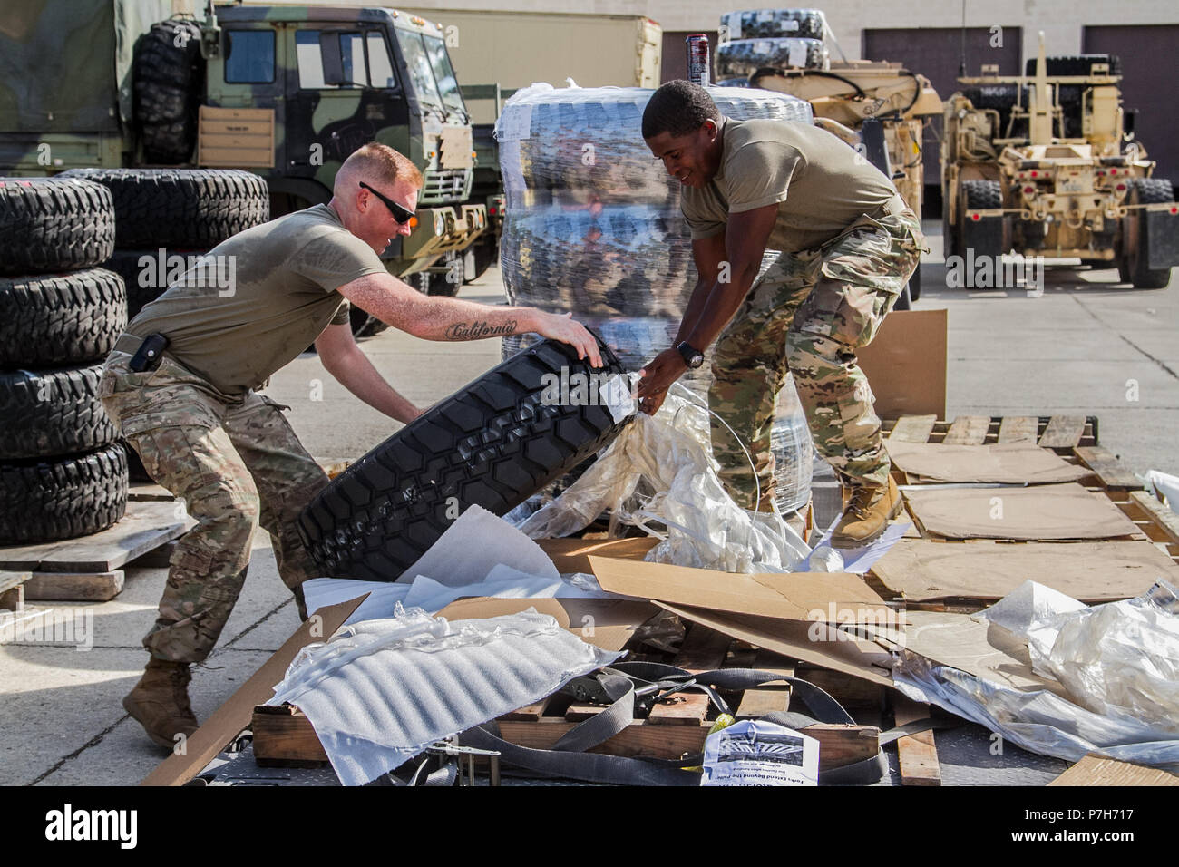 Sgt. Joseph Ball (left), and Ssg. Adebayo Adeniyi (right), both wheel ...
