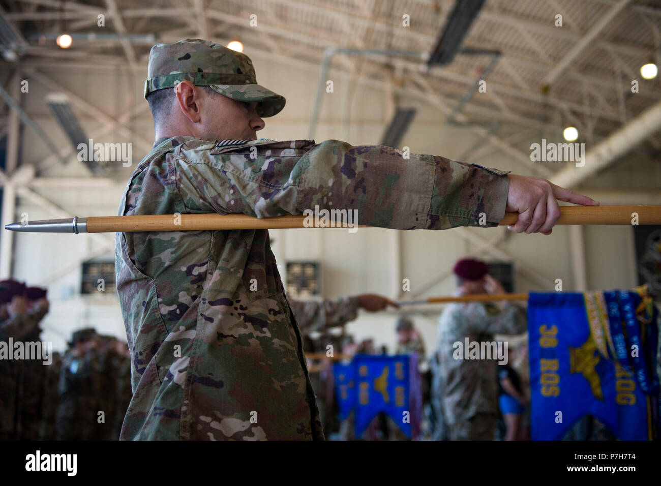 Airmen from the 347th Rescue Group (RQG) present arms during a change ...
