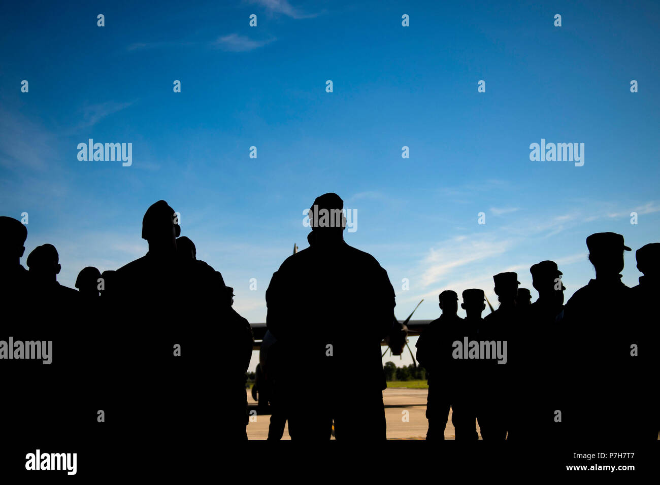 Airmen from the 347th Rescue Group (RQG) stand at parade rest during a ...