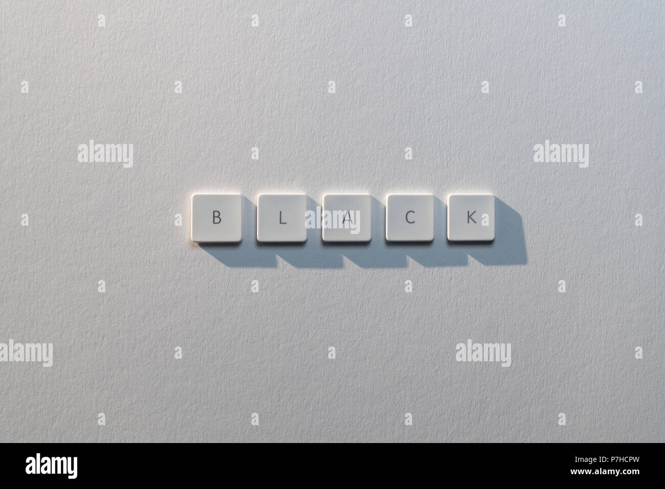 description of the word Black with keyboard letters on white background ...