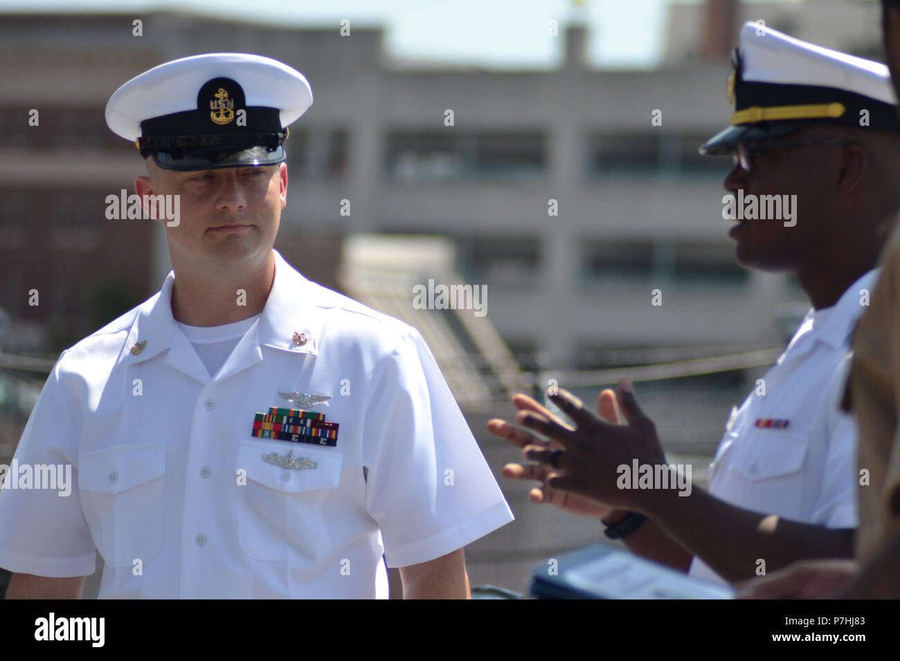 AOC Christopher Crabtree, from the USS Gerald R. Ford, listens to some ...