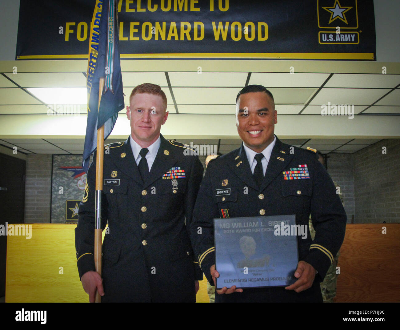 Army Reserve Capt. Lorenzo Llorente II (right), company commander ...