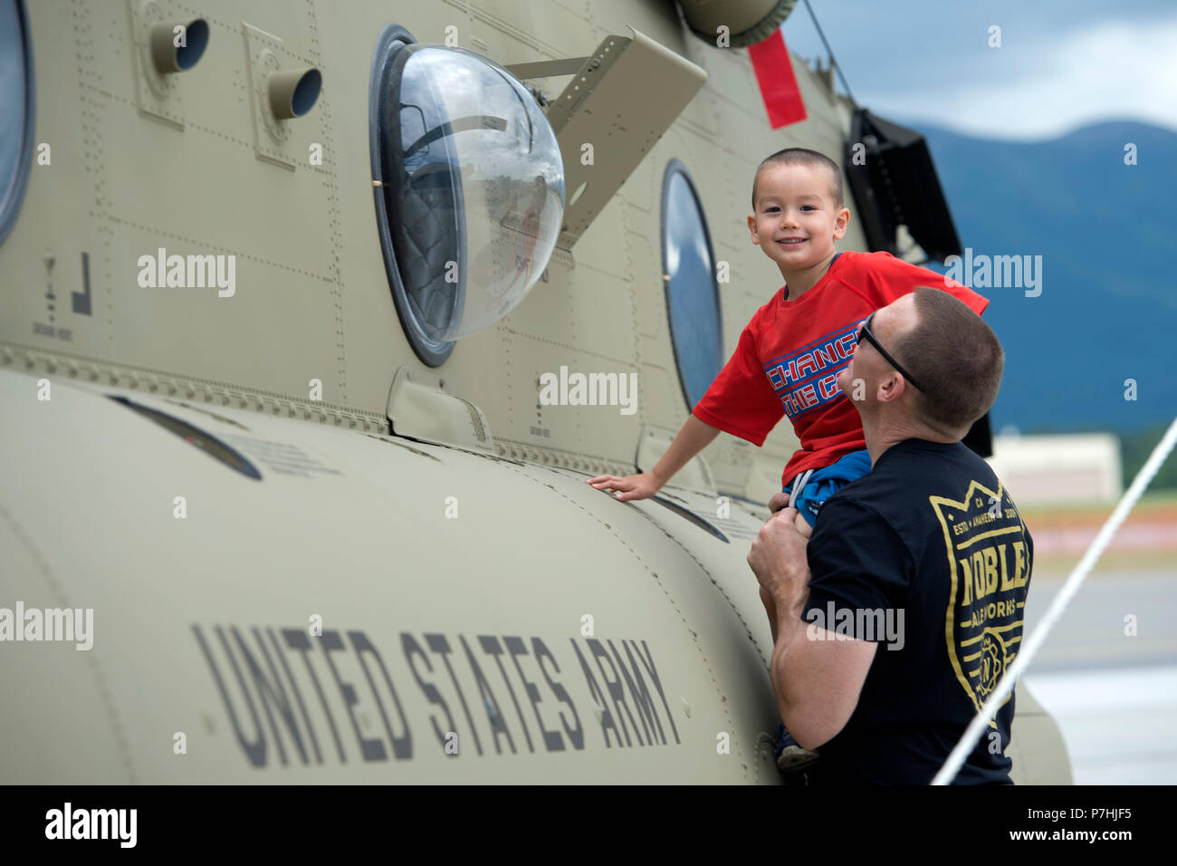 Lincoln, 4, and his father Tech. Sgt. Jeremy Hamblin inspect a CH-47 ...