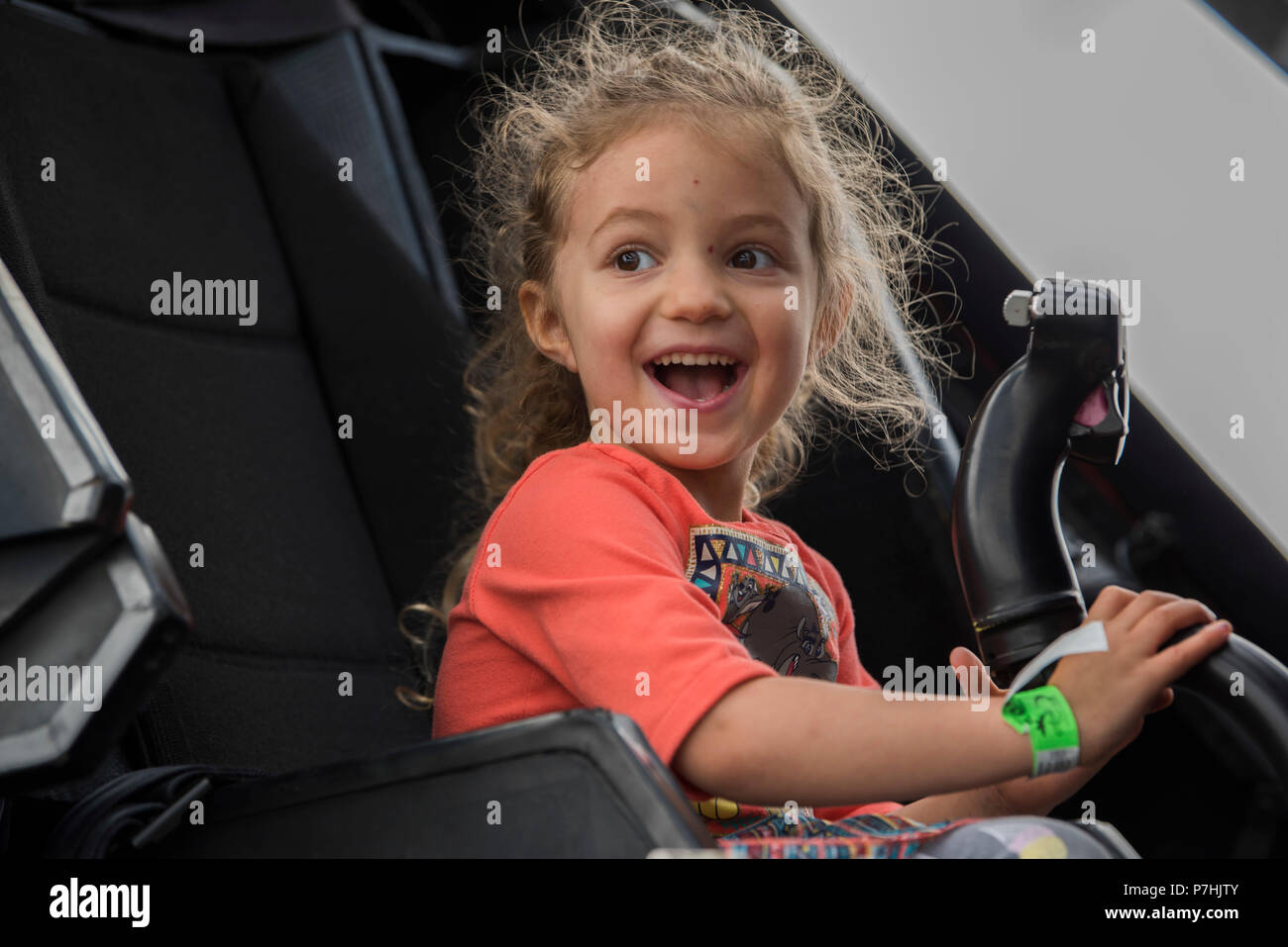 Emily Butcher, 4, sits in a U.S. Army AH-64 Apache attack helicopter ...
