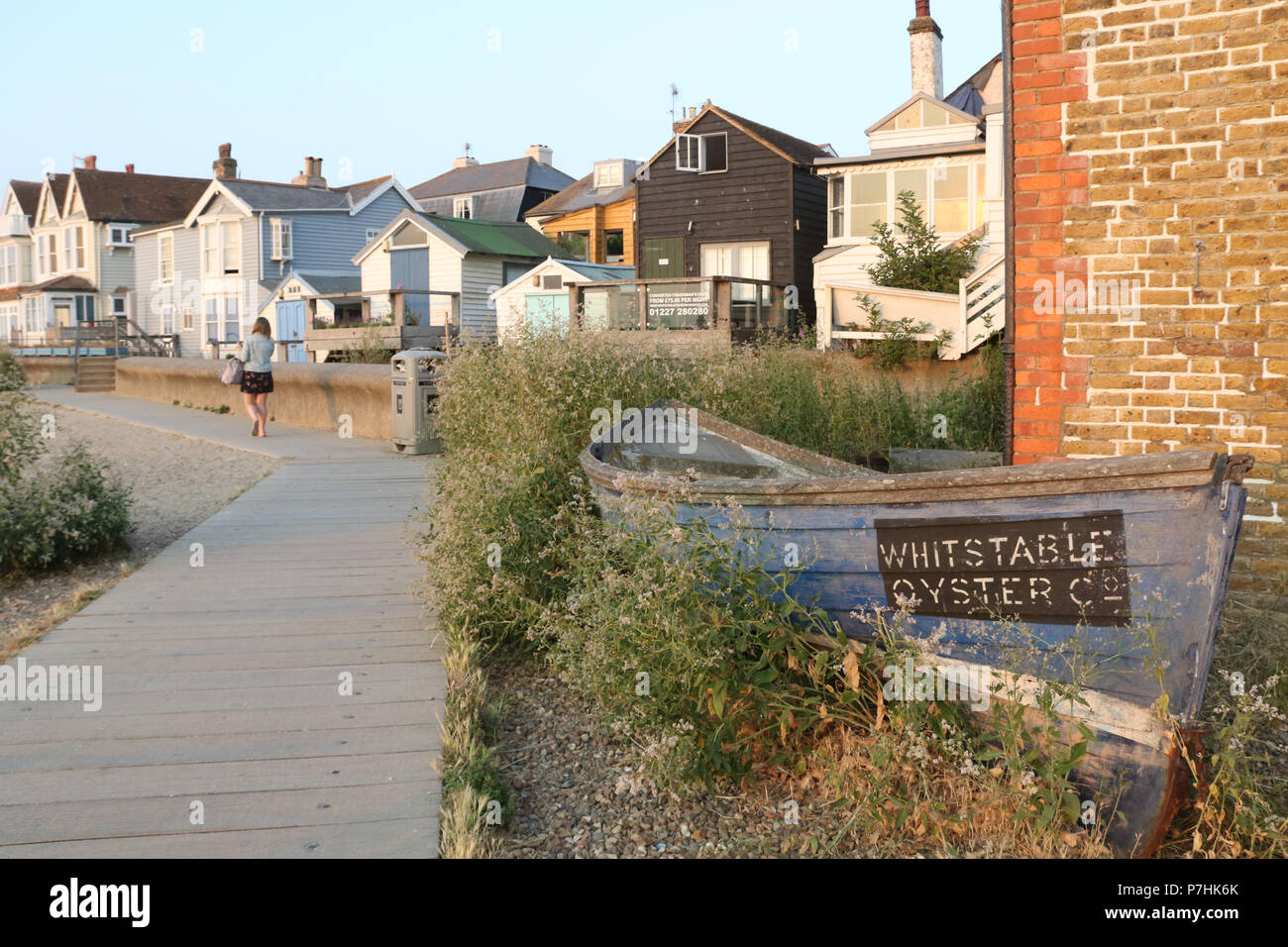 Quaint fisherman’s cottages next to the seafront walkway at Whitstable ...