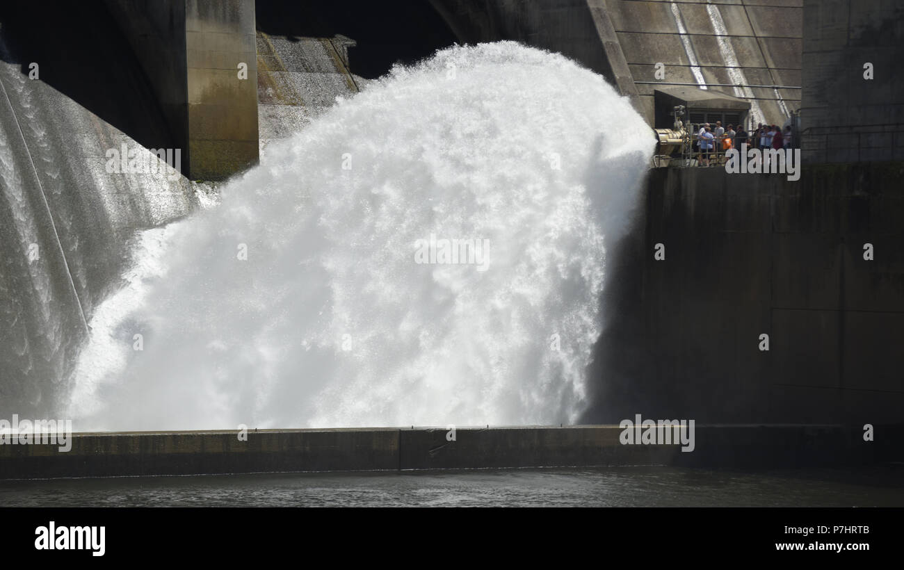 A tour group watches water spray into the tailwater at J. Percy Priest ...
