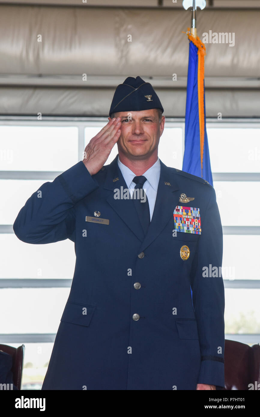U.S. Air Force Col. Mike Drowley renders his first salute to Airmen of ...