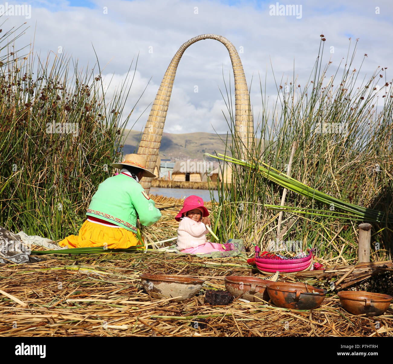 Local family in side the floating Uros Islands at the lake Titicaca ...