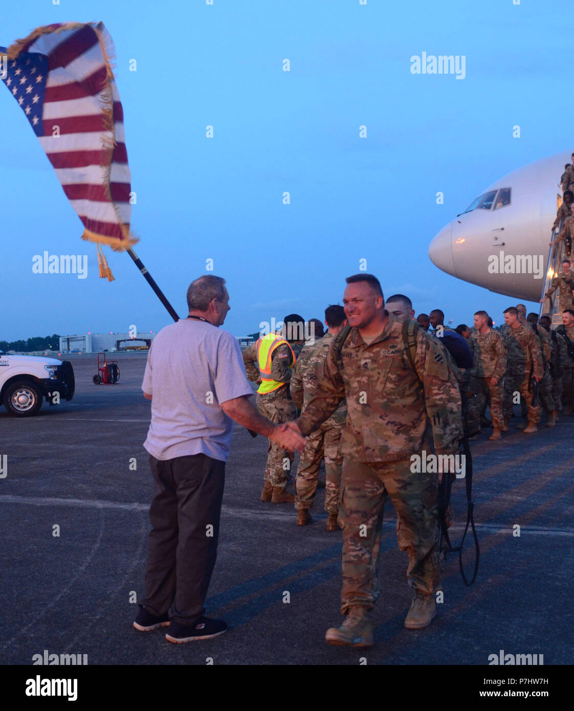 A veteran greets Soldiers of the 3rd Sustainment Brigade, 3rd Infantry ...