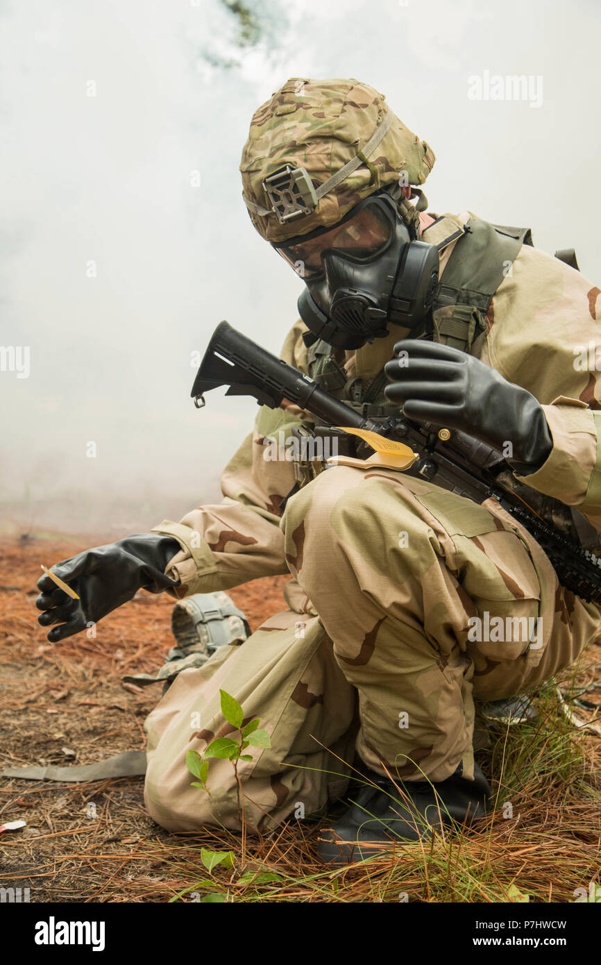 U.S. Army Soldiers takes samples from a simulate Chemical, Biological ...