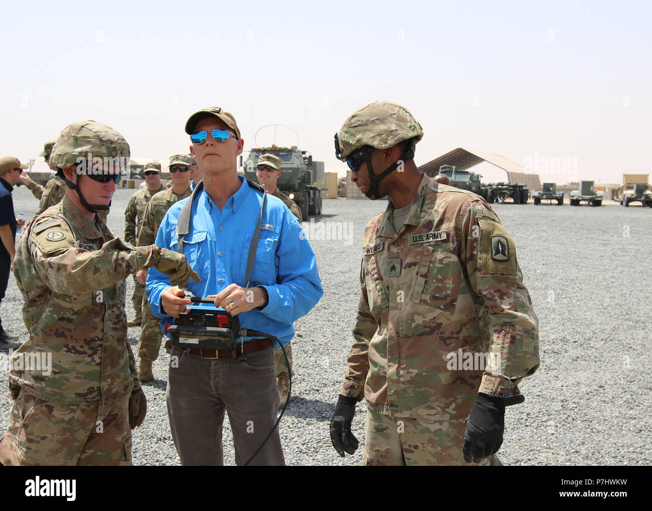 CAMP BUEHRING, Kuwait — Florida Gov. Rick Scott (right) operates a ...