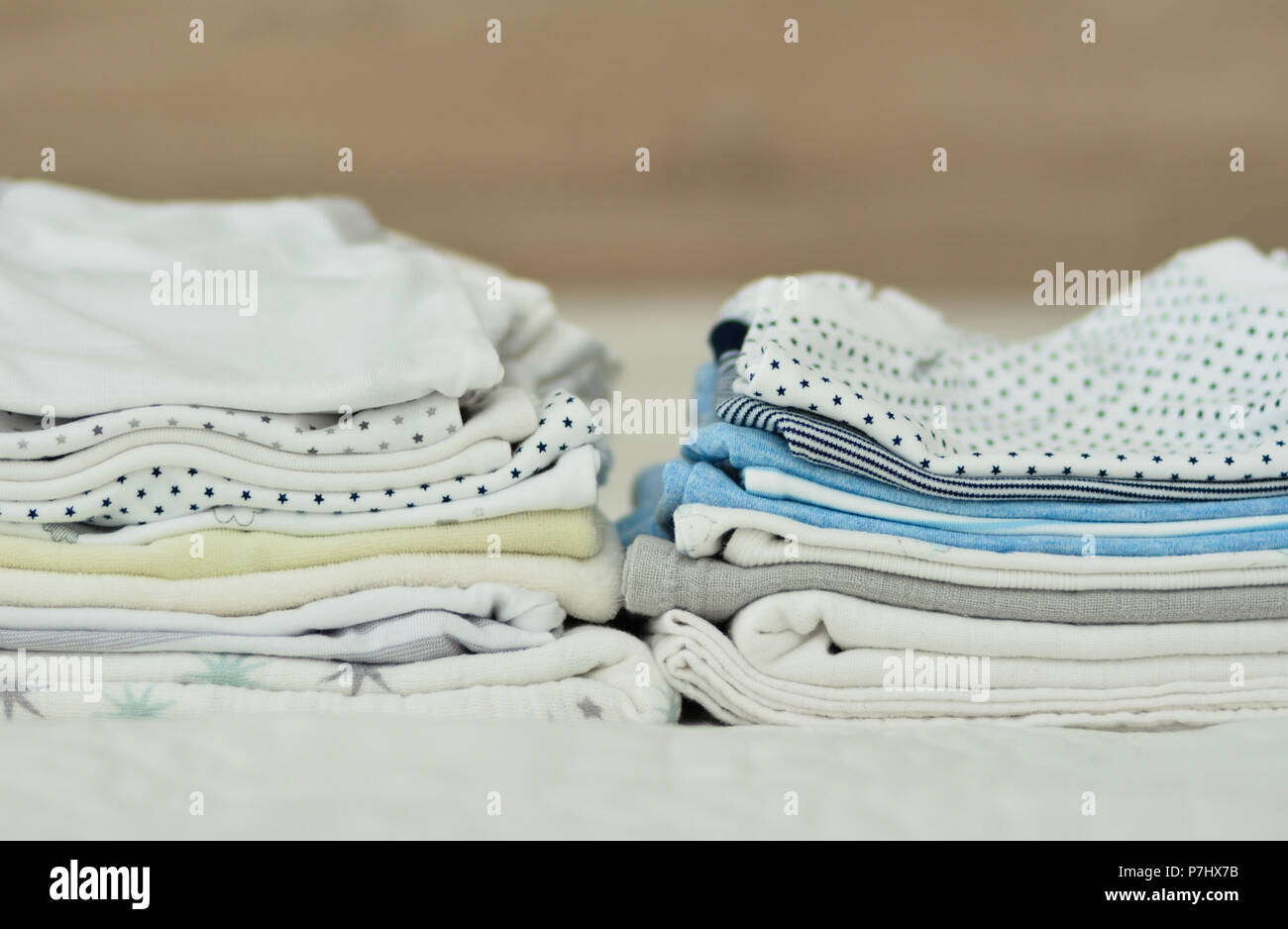 Folded clothes for a newborn boy Stock Photo - Alamy