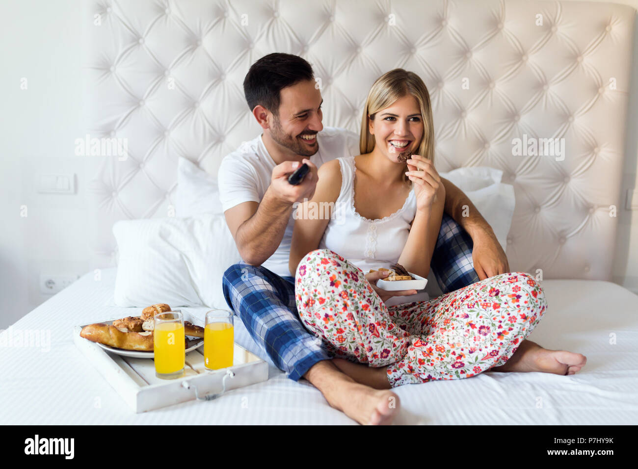 Young couple having having romantic times in bedroom Stock Photo - Alamy