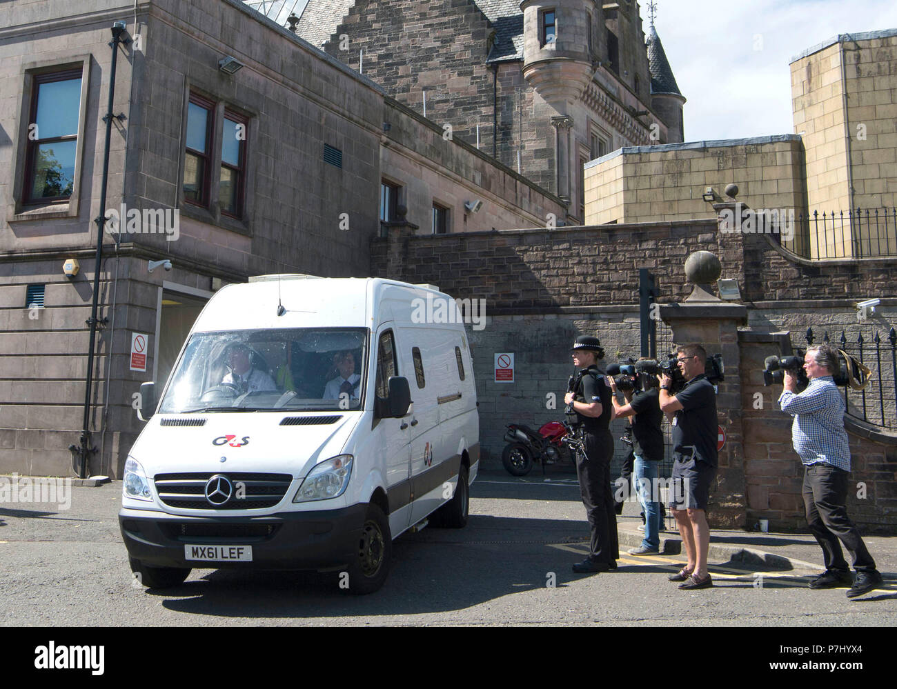 A 16 year old male leaves Greenock Sheriff Court after being charged ...