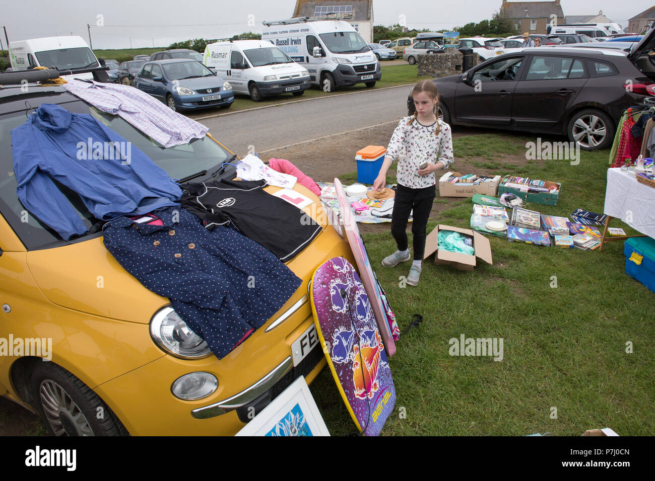 A car boot sale on the village green at the Lizard, Cornwall, England ...