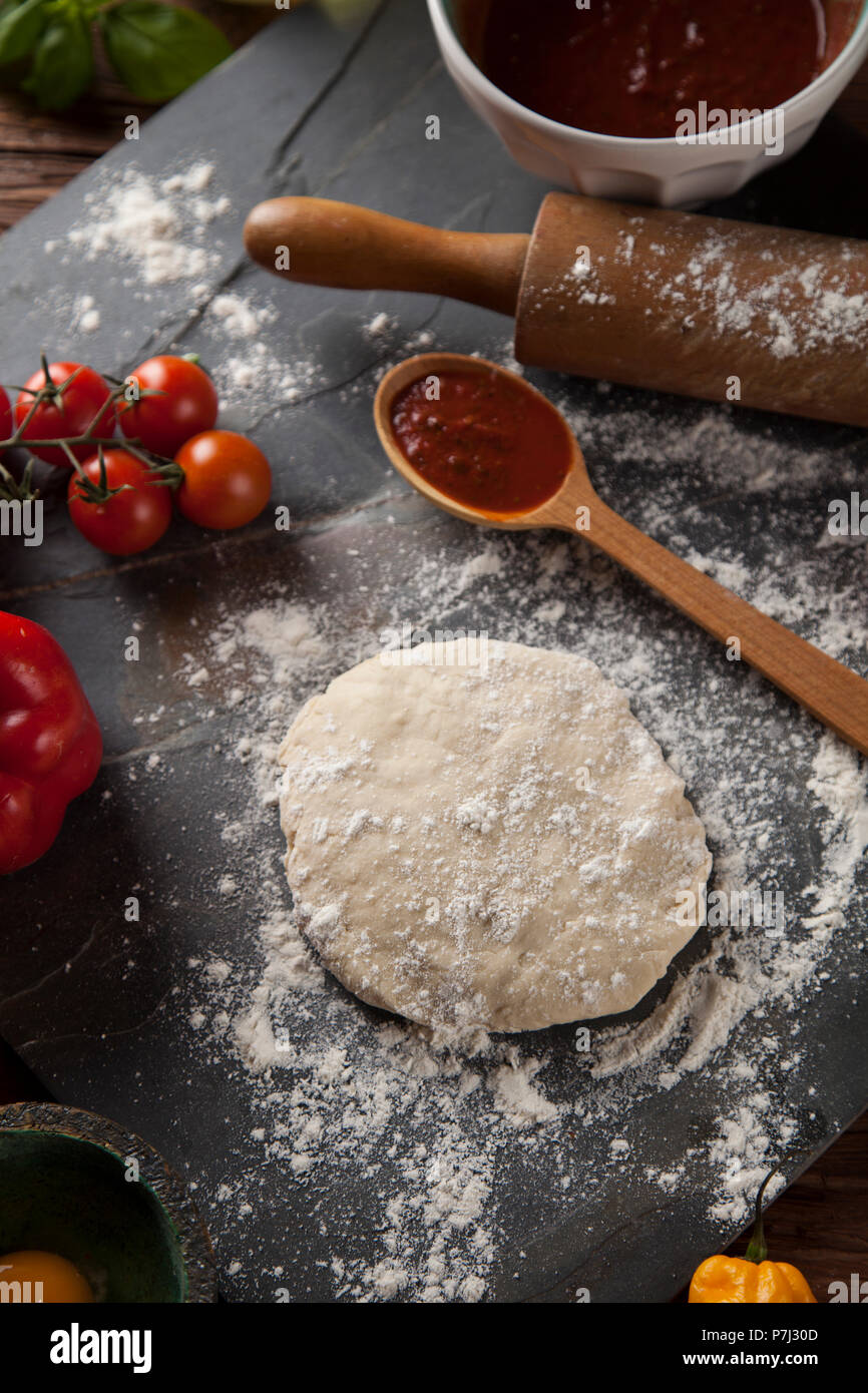 Homemade italian pizza preparation Stock Photo - Alamy