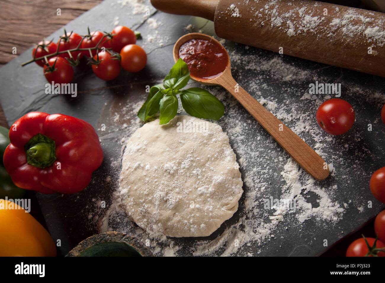 Homemade italian pizza preparation Stock Photo - Alamy
