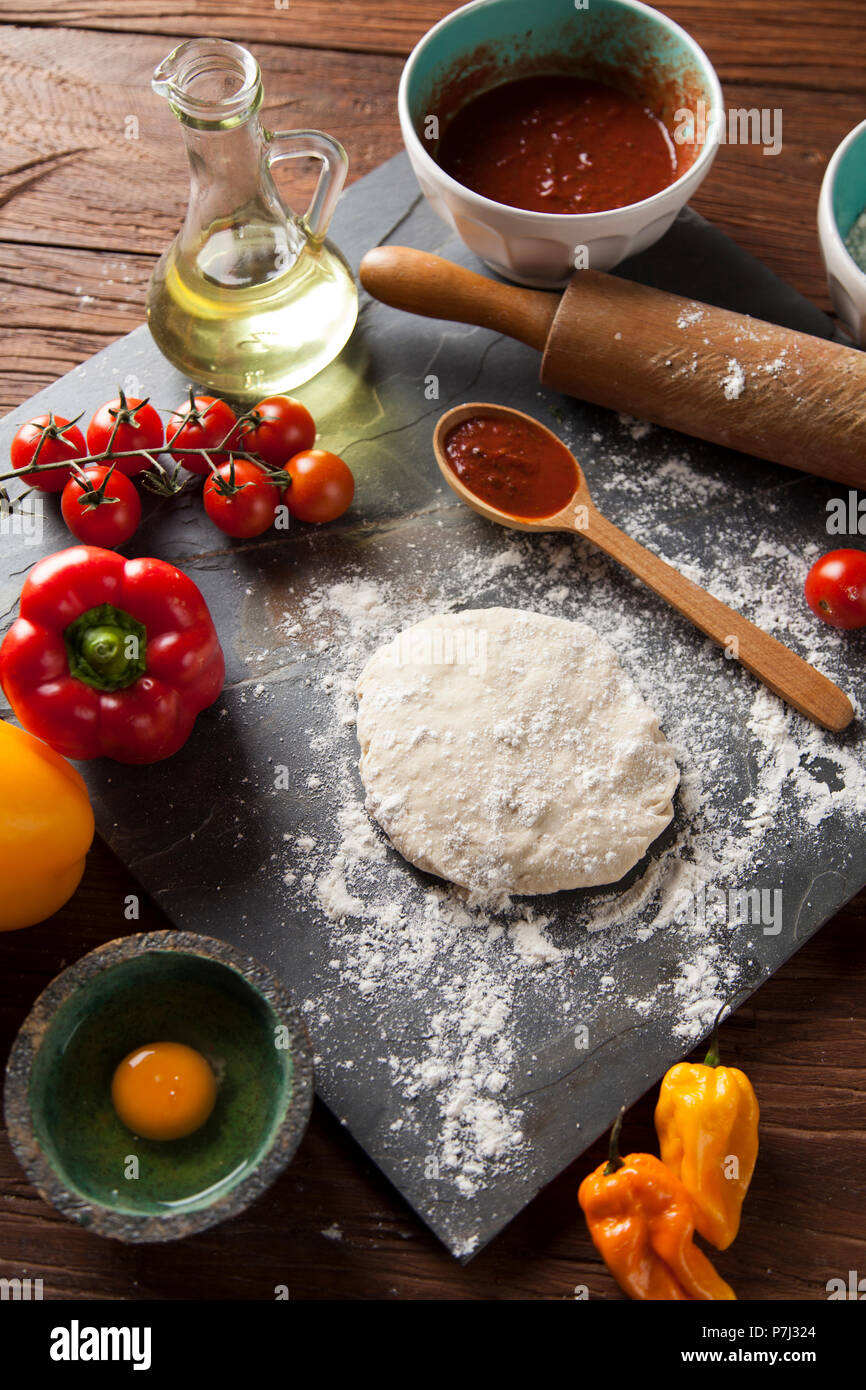 Homemade italian pizza preparation Stock Photo - Alamy