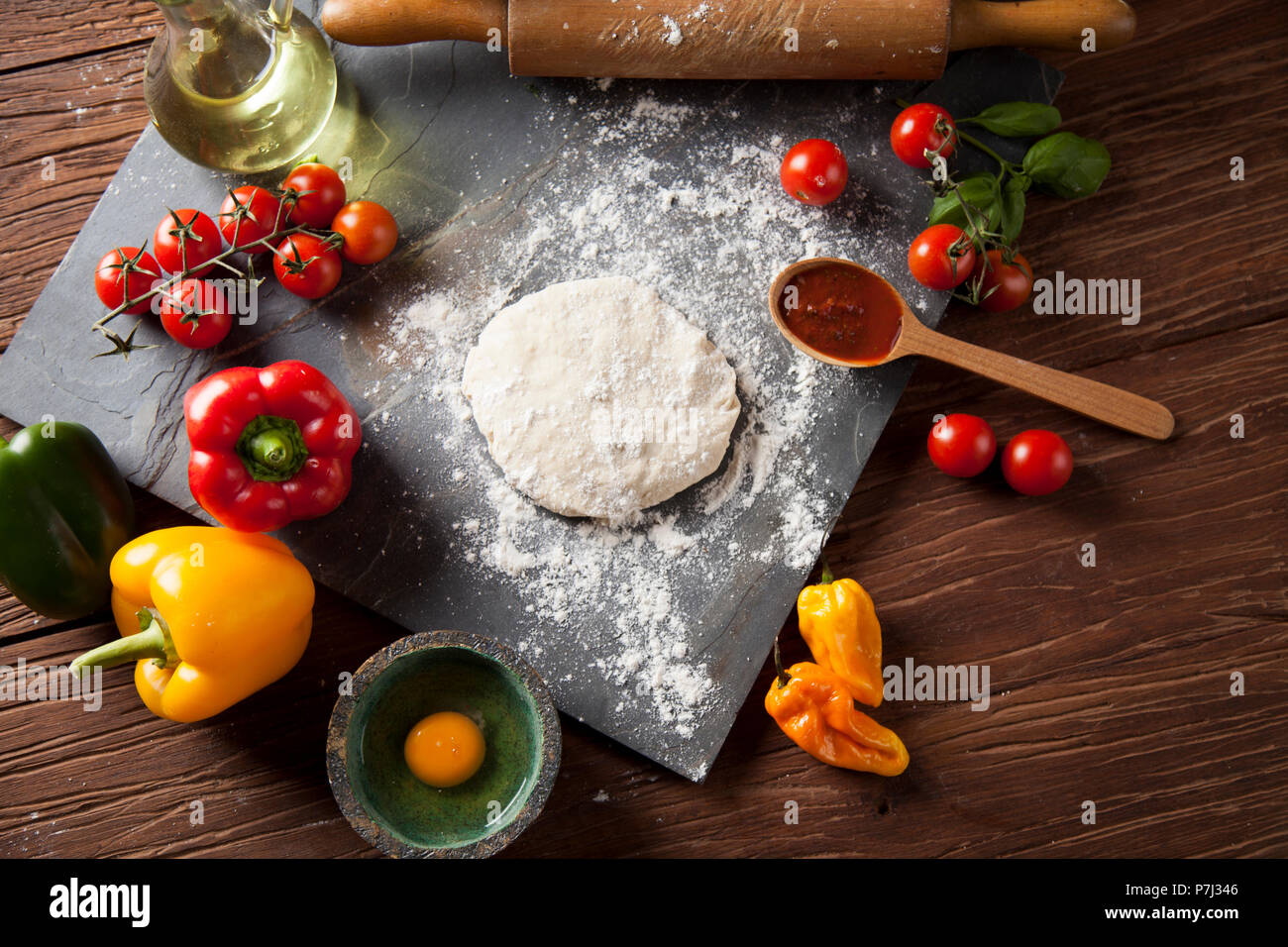 Homemade italian pizza preparation Stock Photo - Alamy