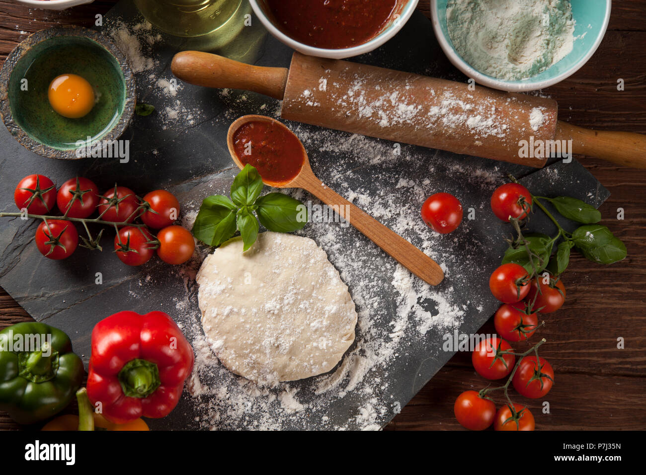 Homemade italian pizza preparation Stock Photo - Alamy