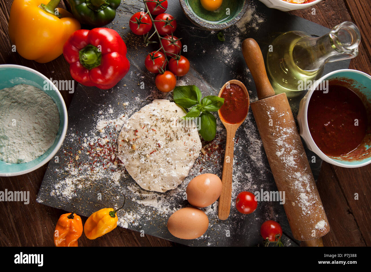 Homemade italian pizza preparation Stock Photo - Alamy