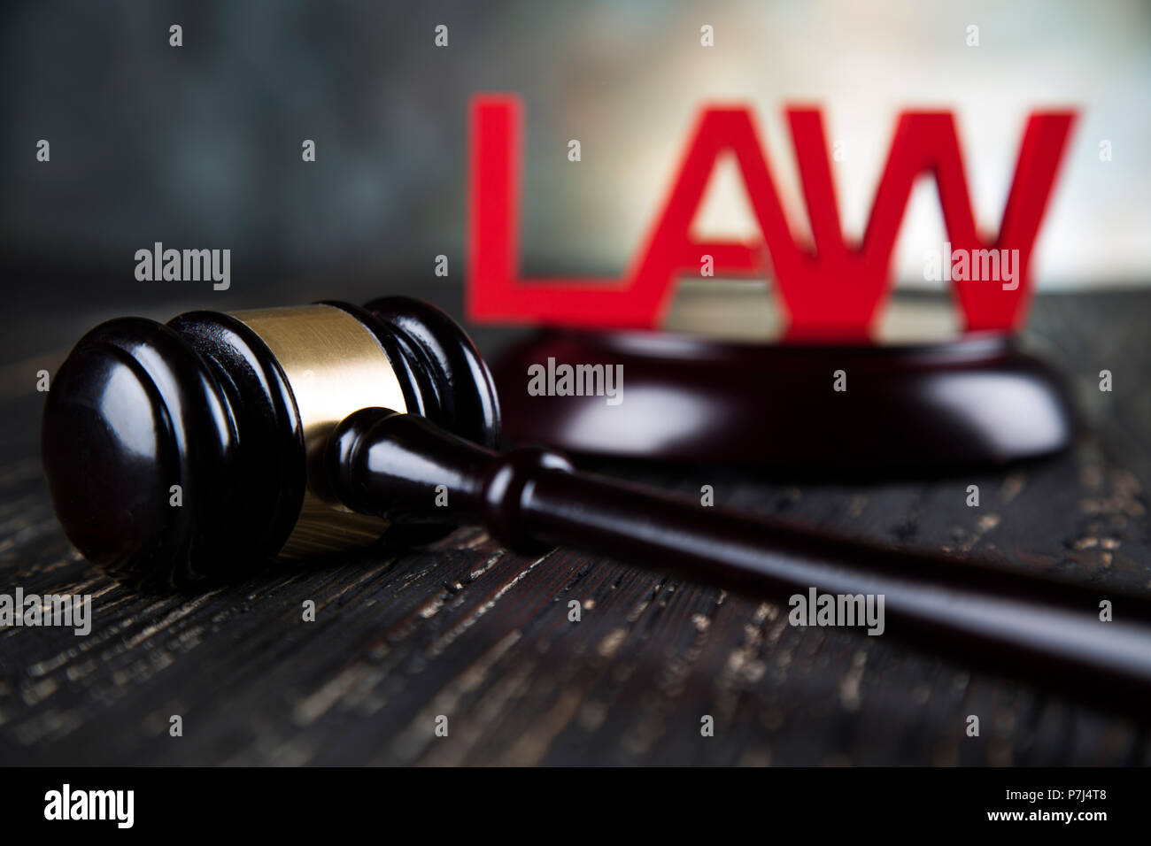 Law theme, mallet of the judge, justice scale, wooden desk background ...