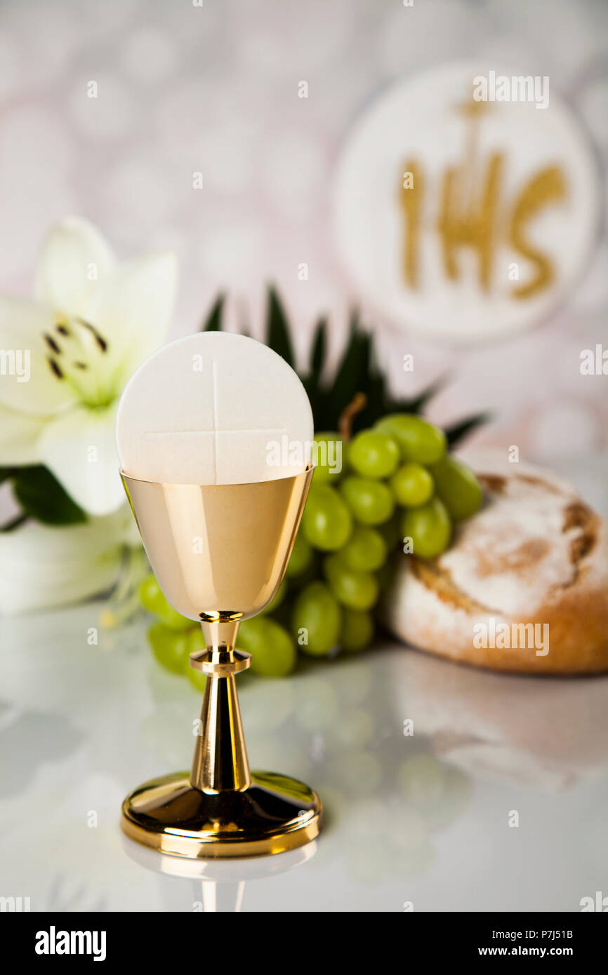 Holy communion a golden chalice with grapes and bread wafers Stock ...