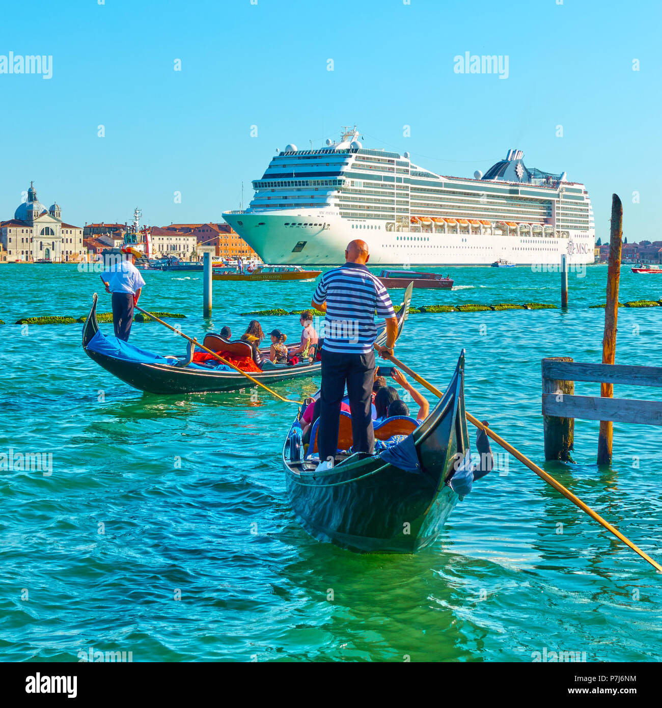 Venice, Italy - June 16, 2018: Large cruise ship and gondolas near ...