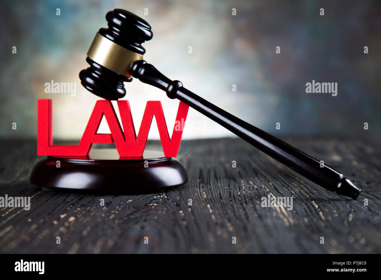 Law theme, mallet of the judge, justice scale, wooden desk background ...