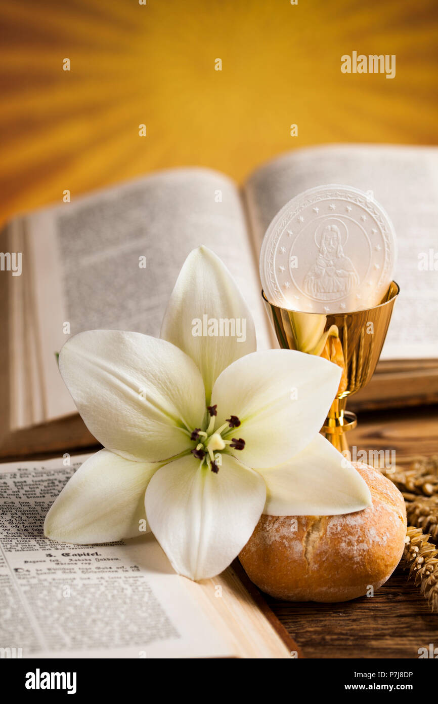 Holy communion a golden chalice with grapes and bread wafers Stock ...