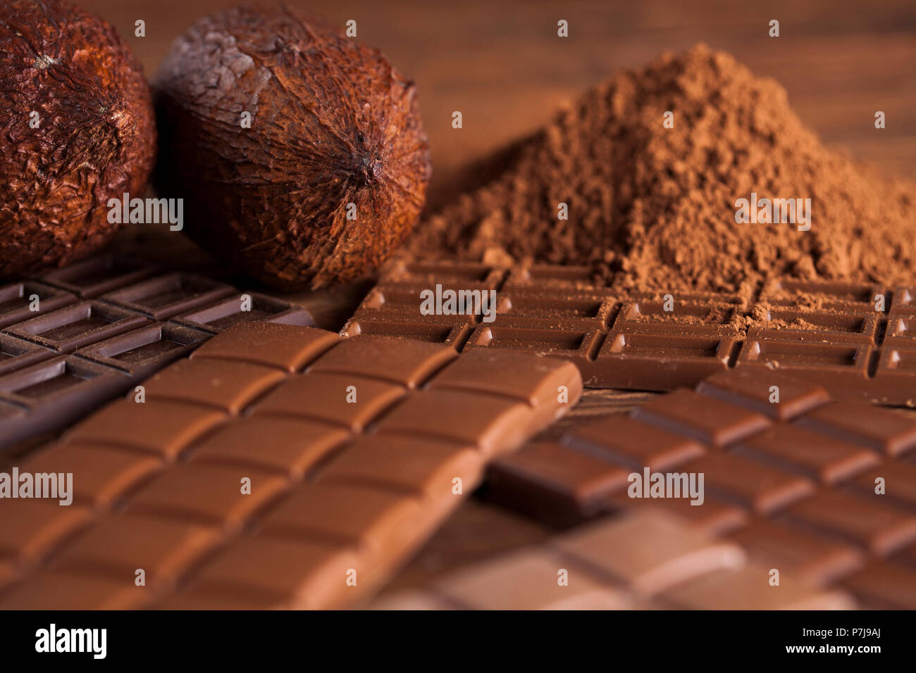 Cocoa pod and chocolate bar and food dessert background Stock Photo - Alamy