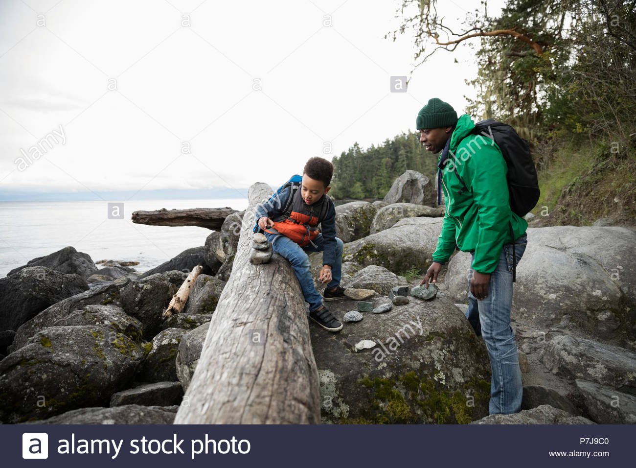 Child stacking rocks hi-res stock photography and images - Alamy