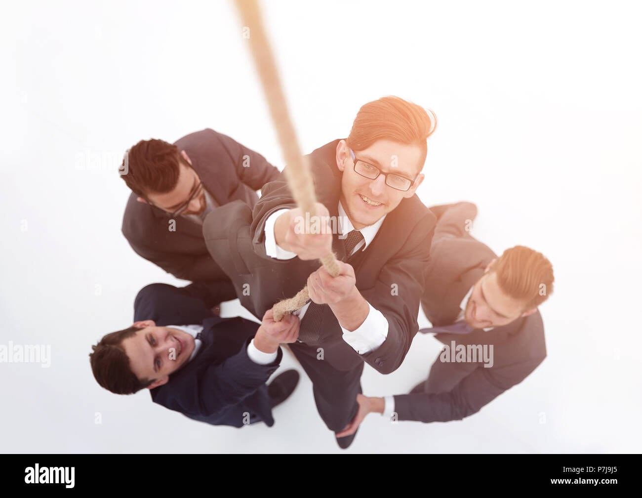 business team helping the leader to climb the rope Stock Photo - Alamy