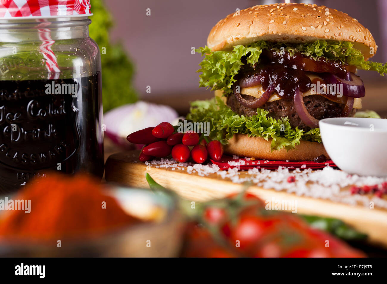 Close-up of home made burgers, wooden desk background Stock Photo - Alamy